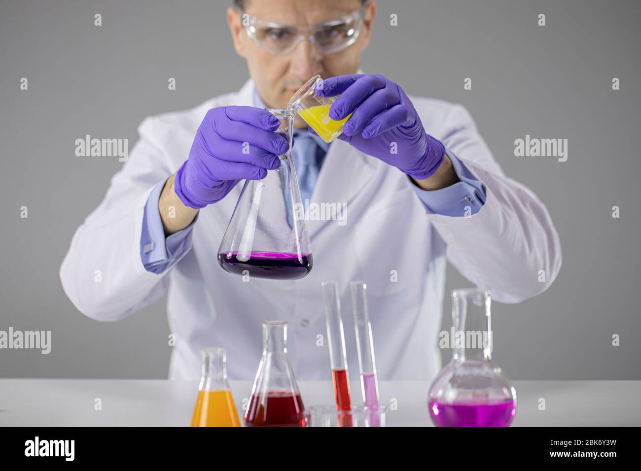 Scientist working at lab with reaction tubes, performing science ...