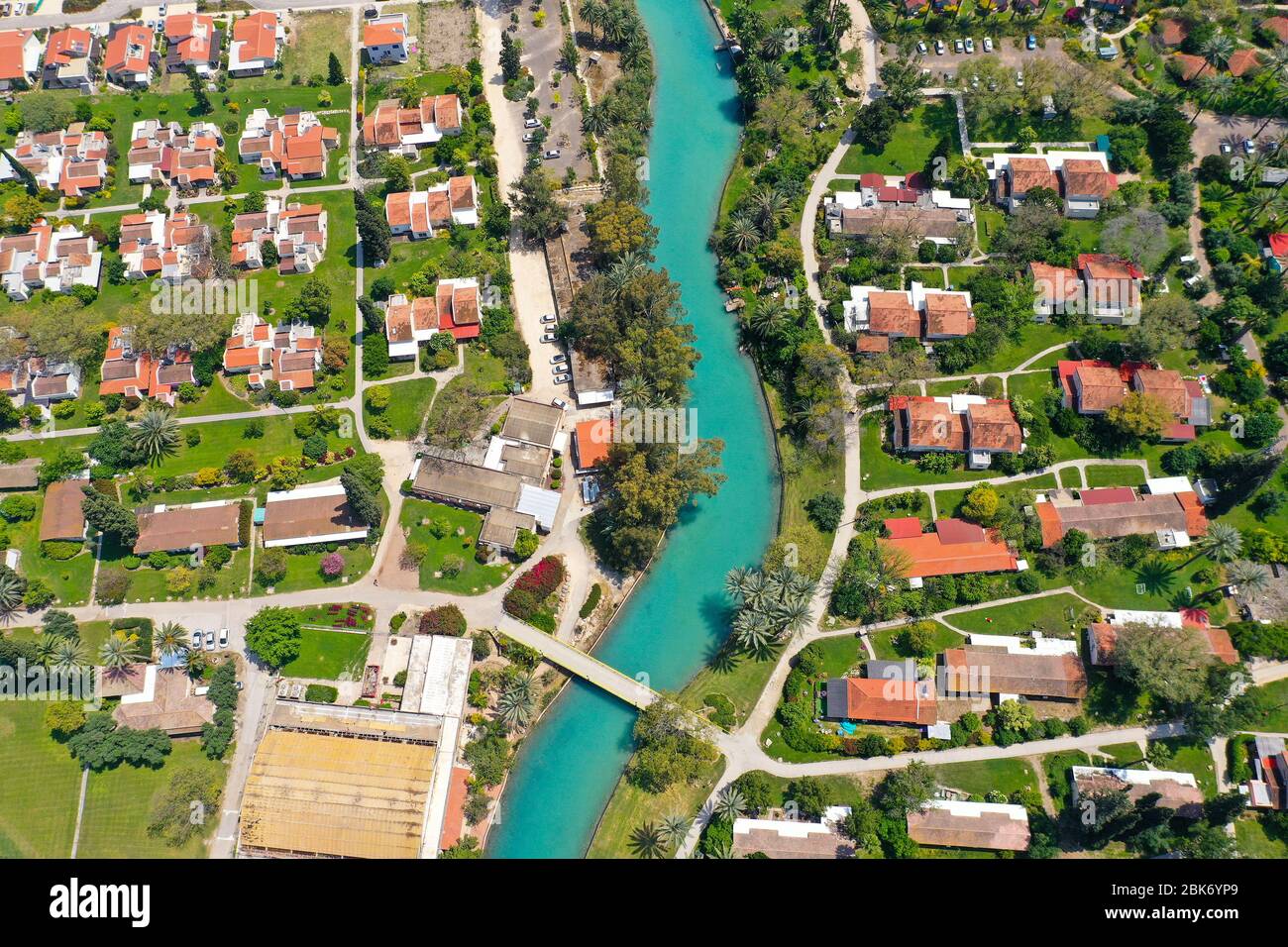 Aerial image of Kibbutz Nir David with Amal river channel turquoise ...