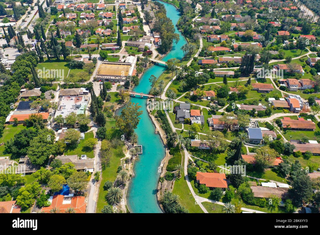Aerial image of Kibbutz Nir David with Amal river channel turquoise ...