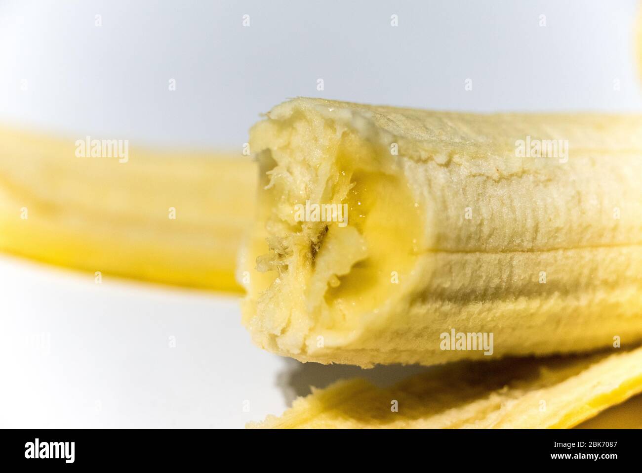 realistic picture of half eaten banana Stock Photo - Alamy