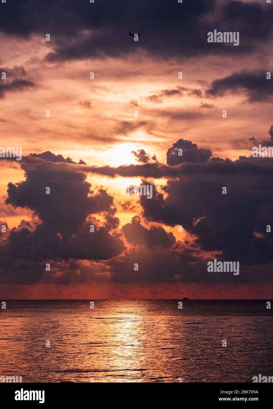 Airplane In Sky Sunset Over Ocean High Resolution Stock Photography and ...