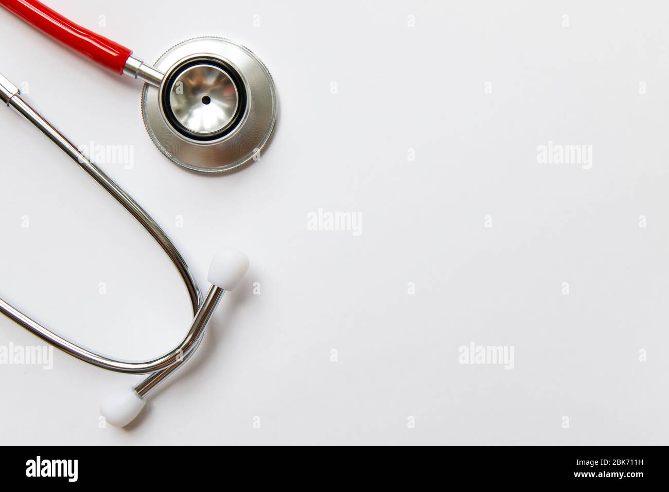 Closeup of red stethoscope - medical diagnostic device for auscultation ...