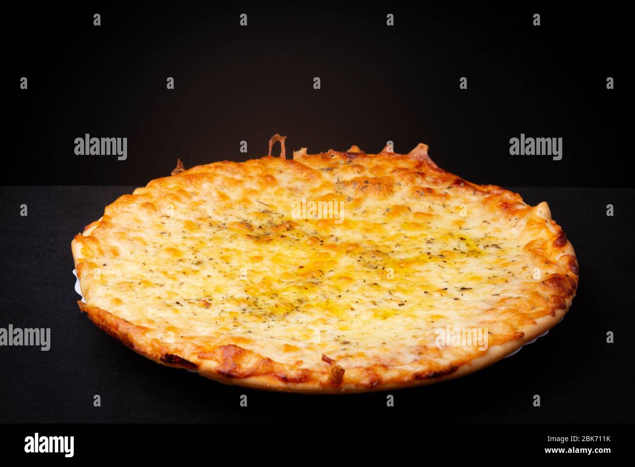 Four cheese home baked pizza without topping and with crunchy crest and ...