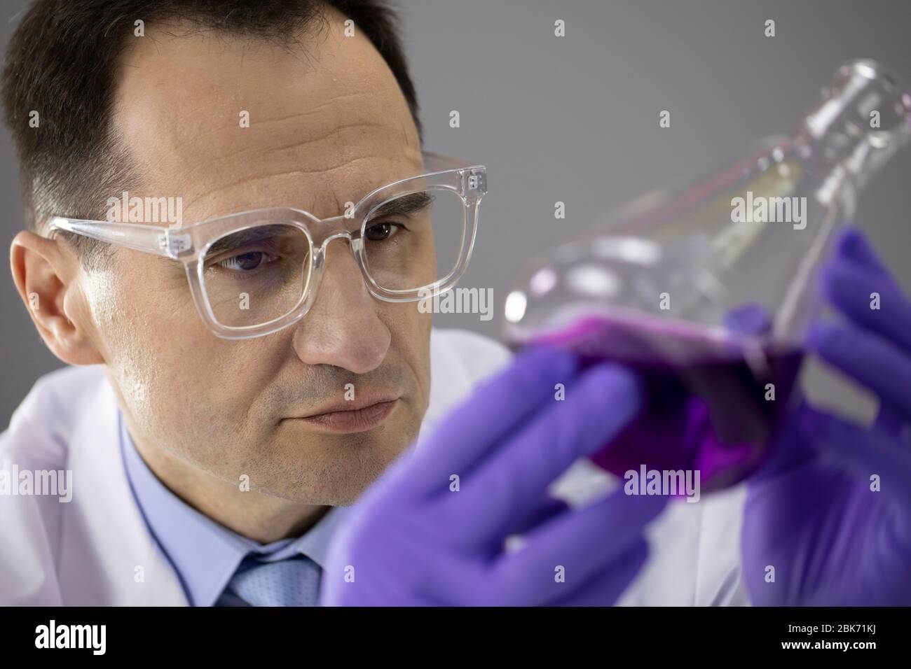 Close up researcher checking chemical formula in academic laboratory ...