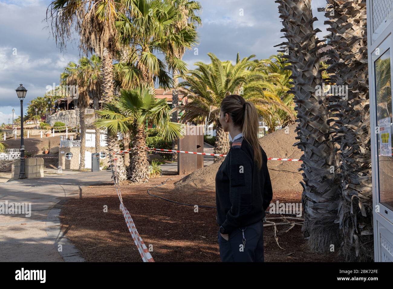 Female security guard on watch outside the Bahia del Duque hotel during ...