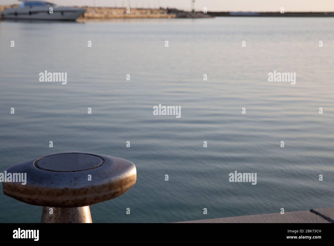 The steel bollard in a harbor quay Stock Photo - Alamy