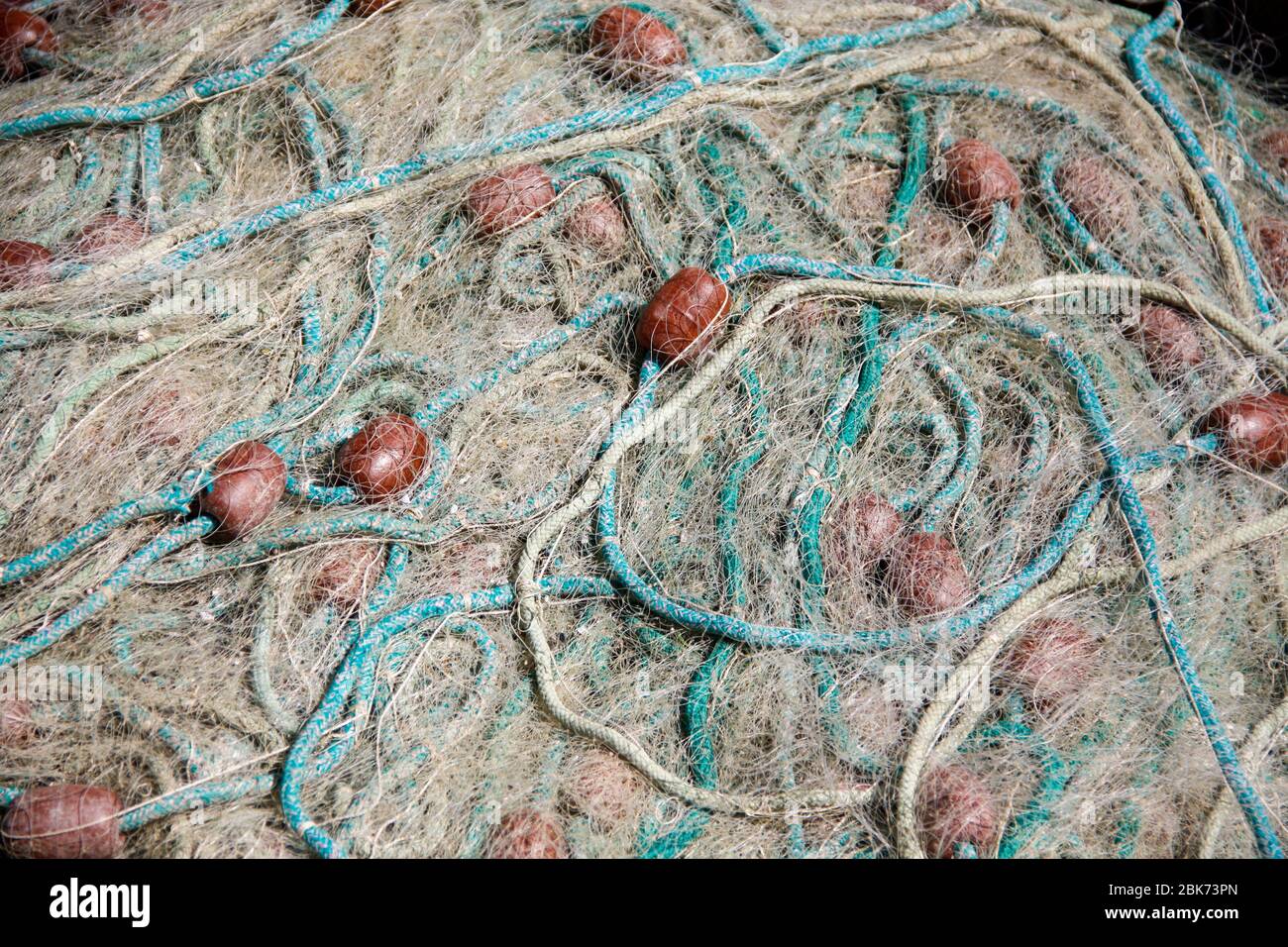 Fishing net in a bucket in Piran, Slovenia Stock Photo - Alamy