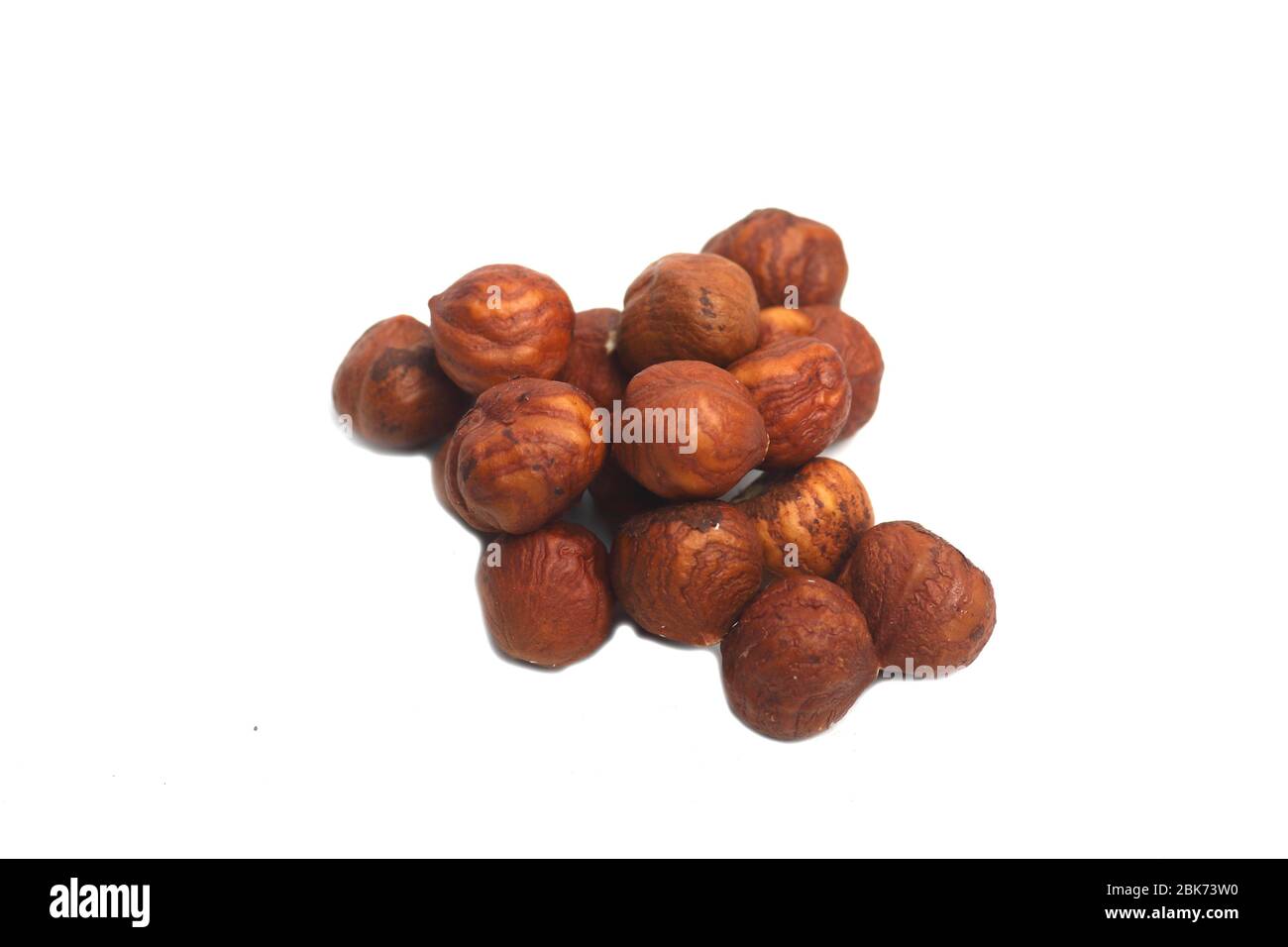 A pile of hazelnut isolated on white background flat lay. Horizontal ...