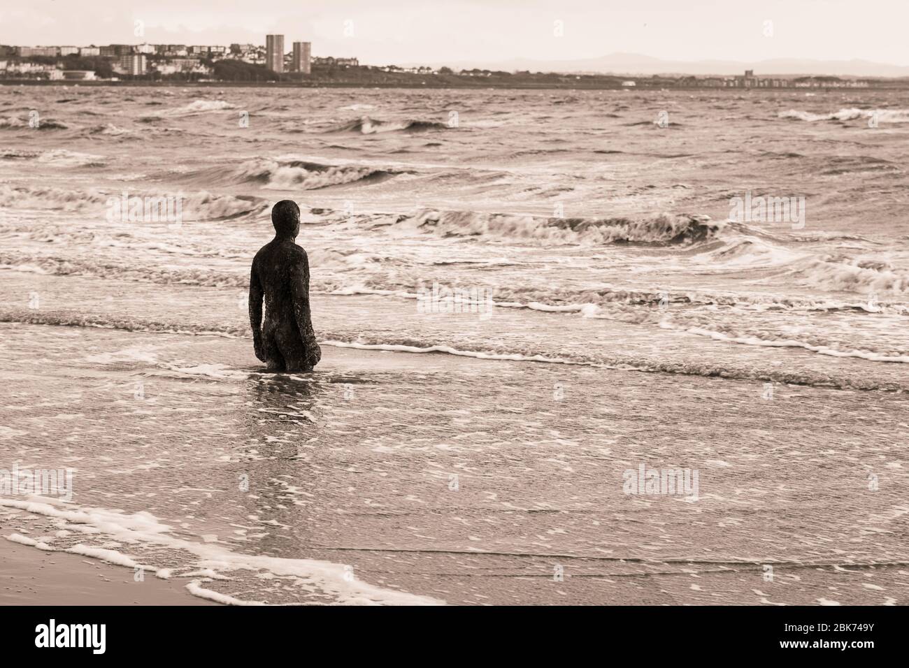 Split toned image of an Iron Man seen on the beach at Crosby near ...