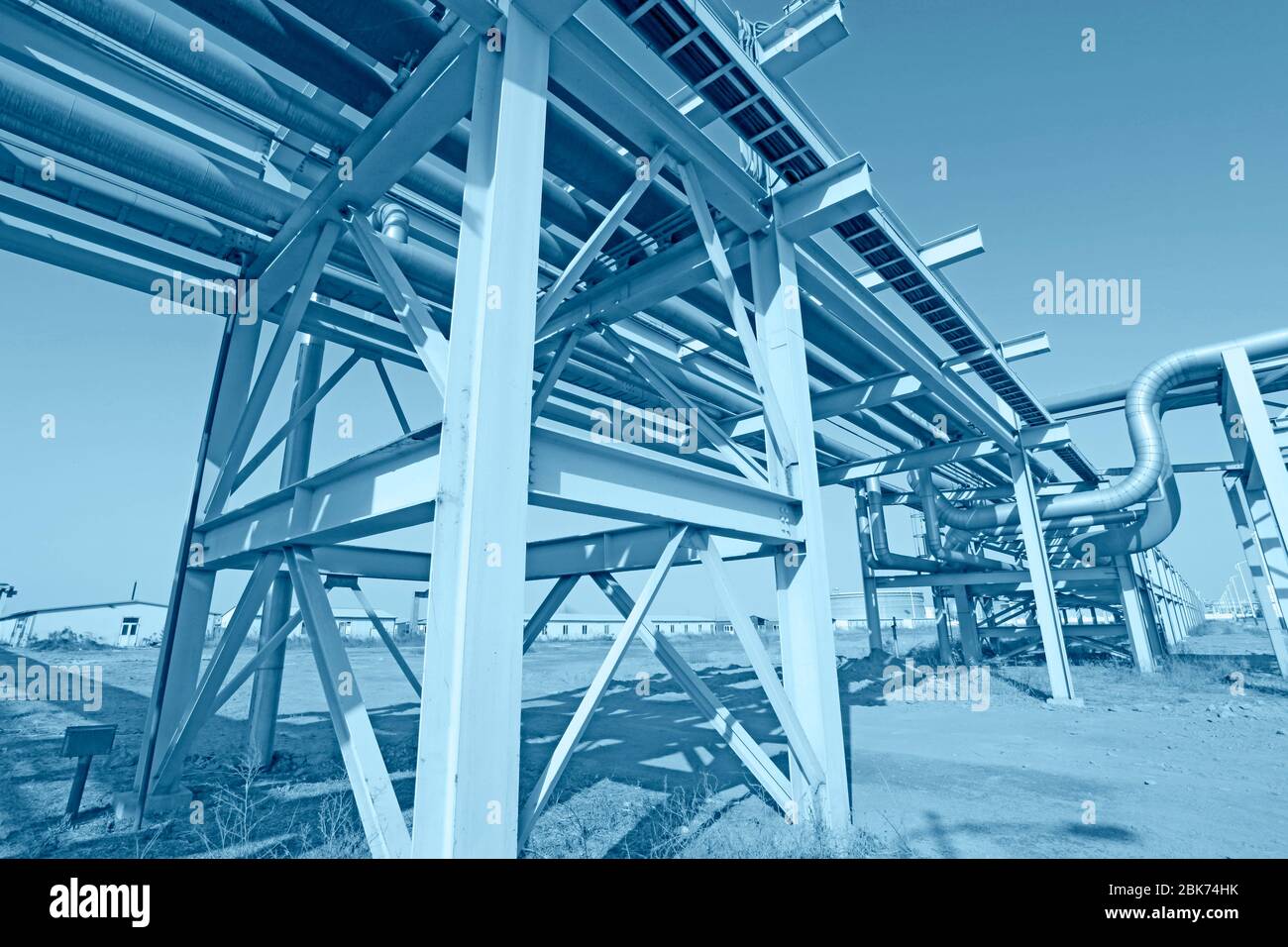 Oil field scene, oil pipelines and facilities Stock Photo - Alamy