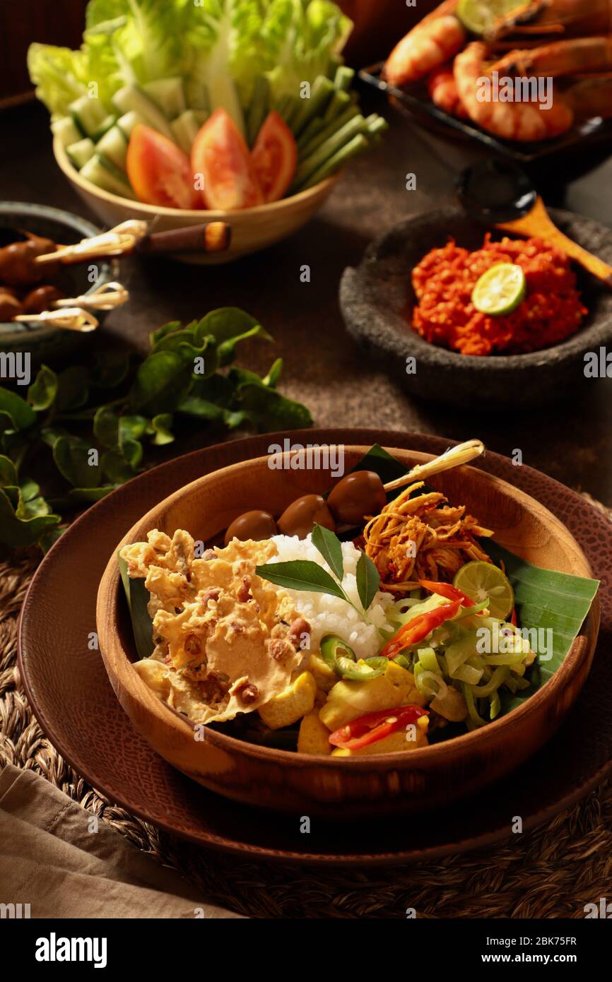 Nasi Campur. Traditional Indonesian meal of rice with meat and ...