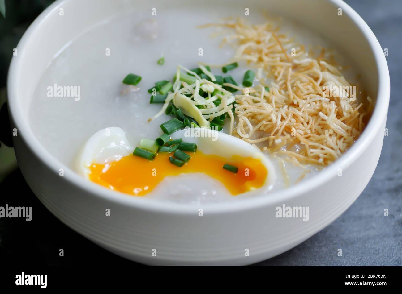 rice gruel, rice porridge or congee with egg Stock Photo - Alamy