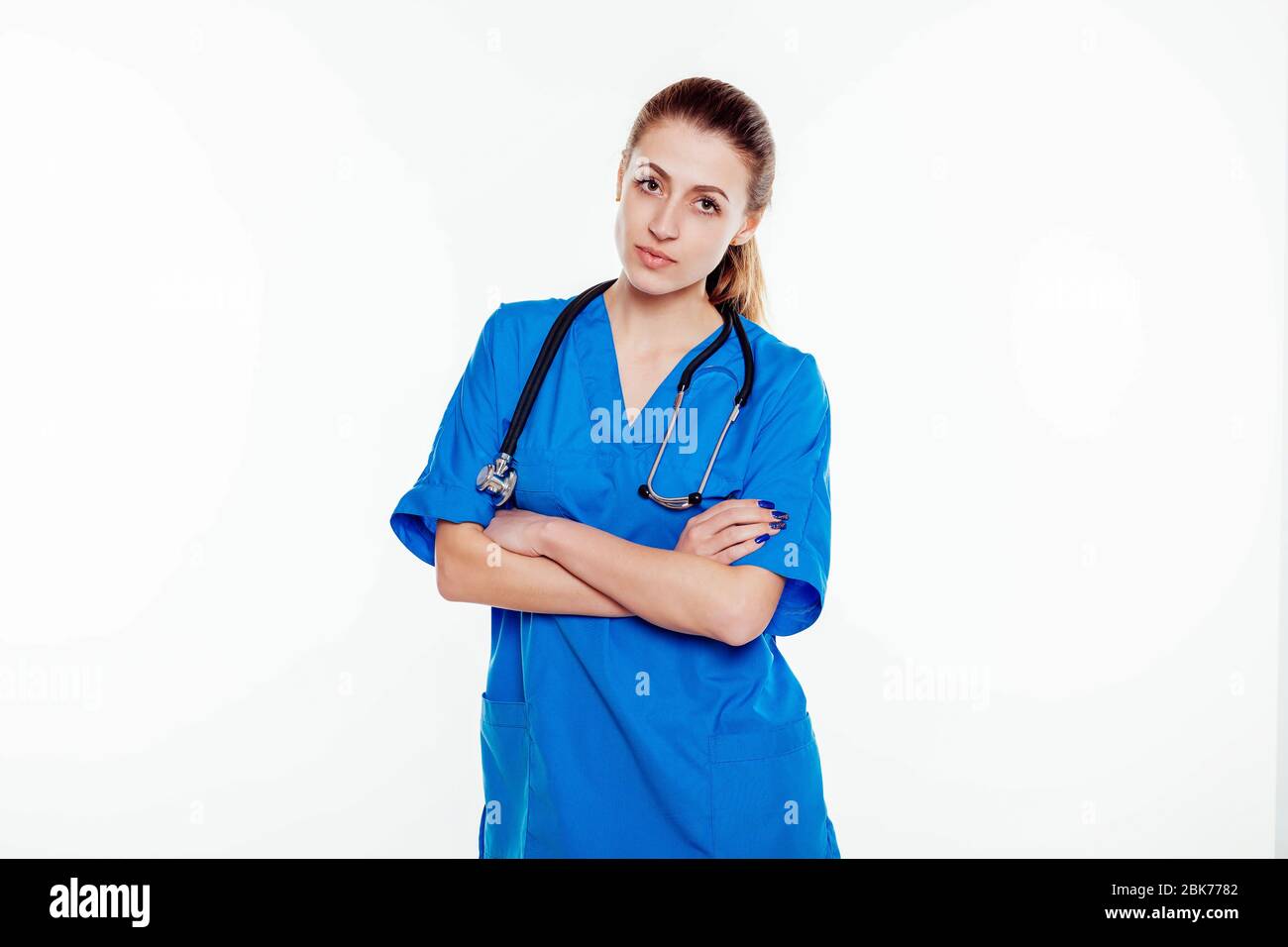 doctor stands at a wall with stethoscope Stock Photo - Alamy