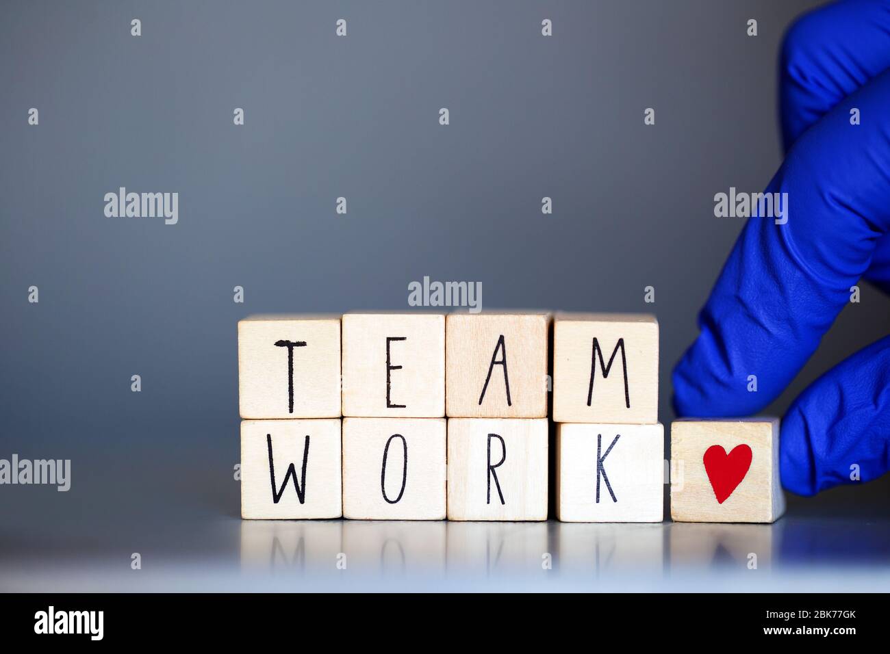 Wooden cubes with the words Team Work for business concept or health ...