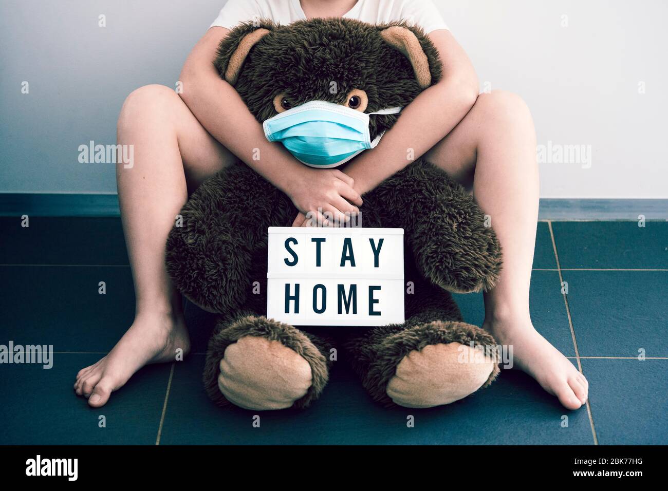 Sad boy with teddy bear hi-res stock photography and images - Alamy