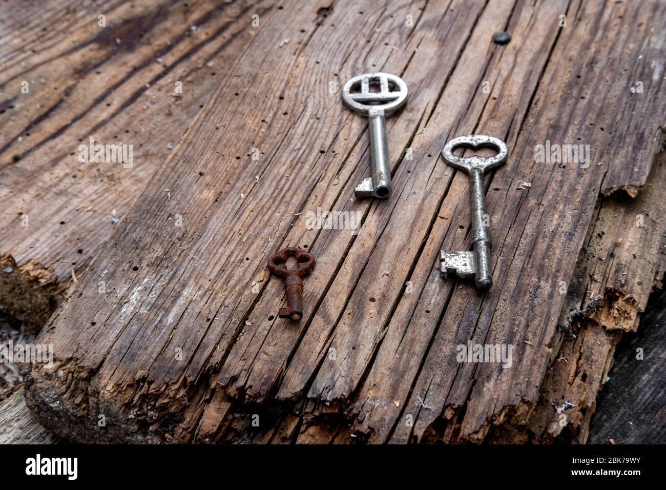 Old keys of different sizes on rustic weathered wood planks Stock Photo ...