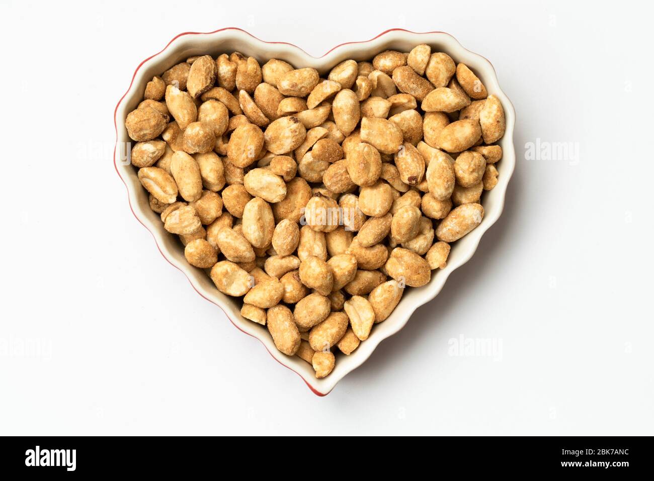 Dry Roasted Peanuts in a Heart Shape Stock Photo - Alamy