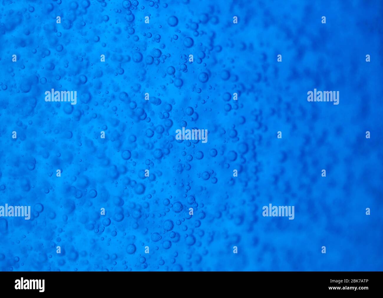 Blue vivid bright liquid with bubbles. Background Stock Photo - Alamy