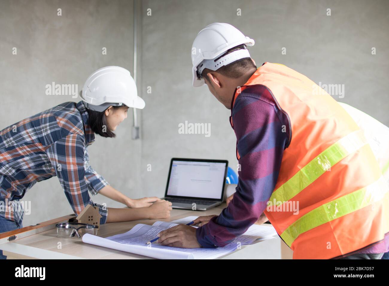 Engineer and worker planning for construction building and renovate in ...