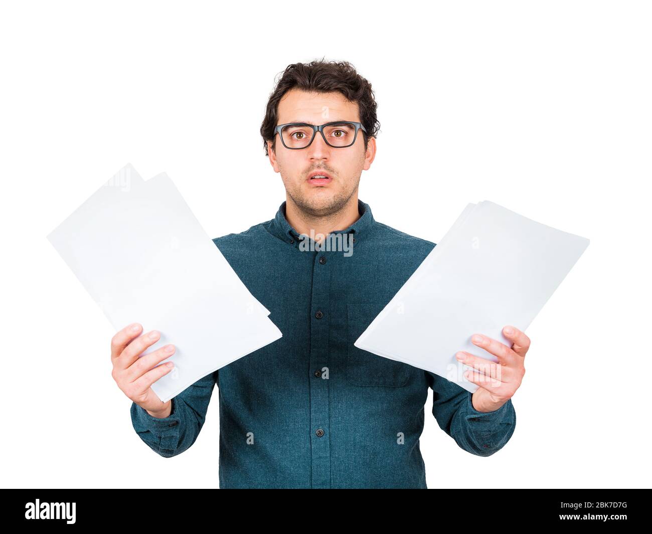 Perplexed businessman looking stunned to camera as holds different ...