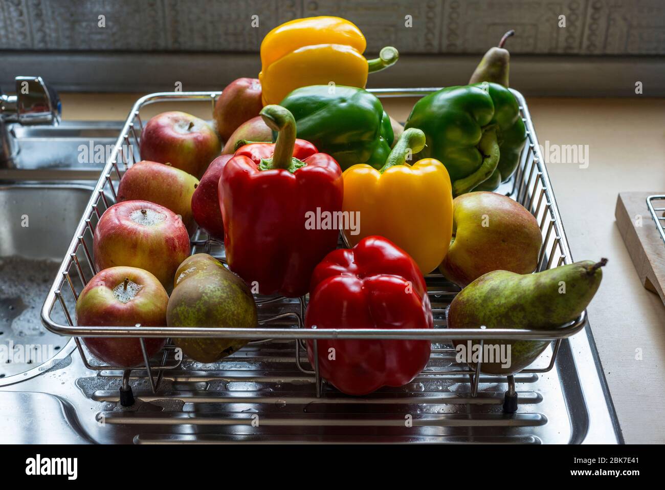 Fresh Fruit and Vegetables drying naturally on draining board after ...