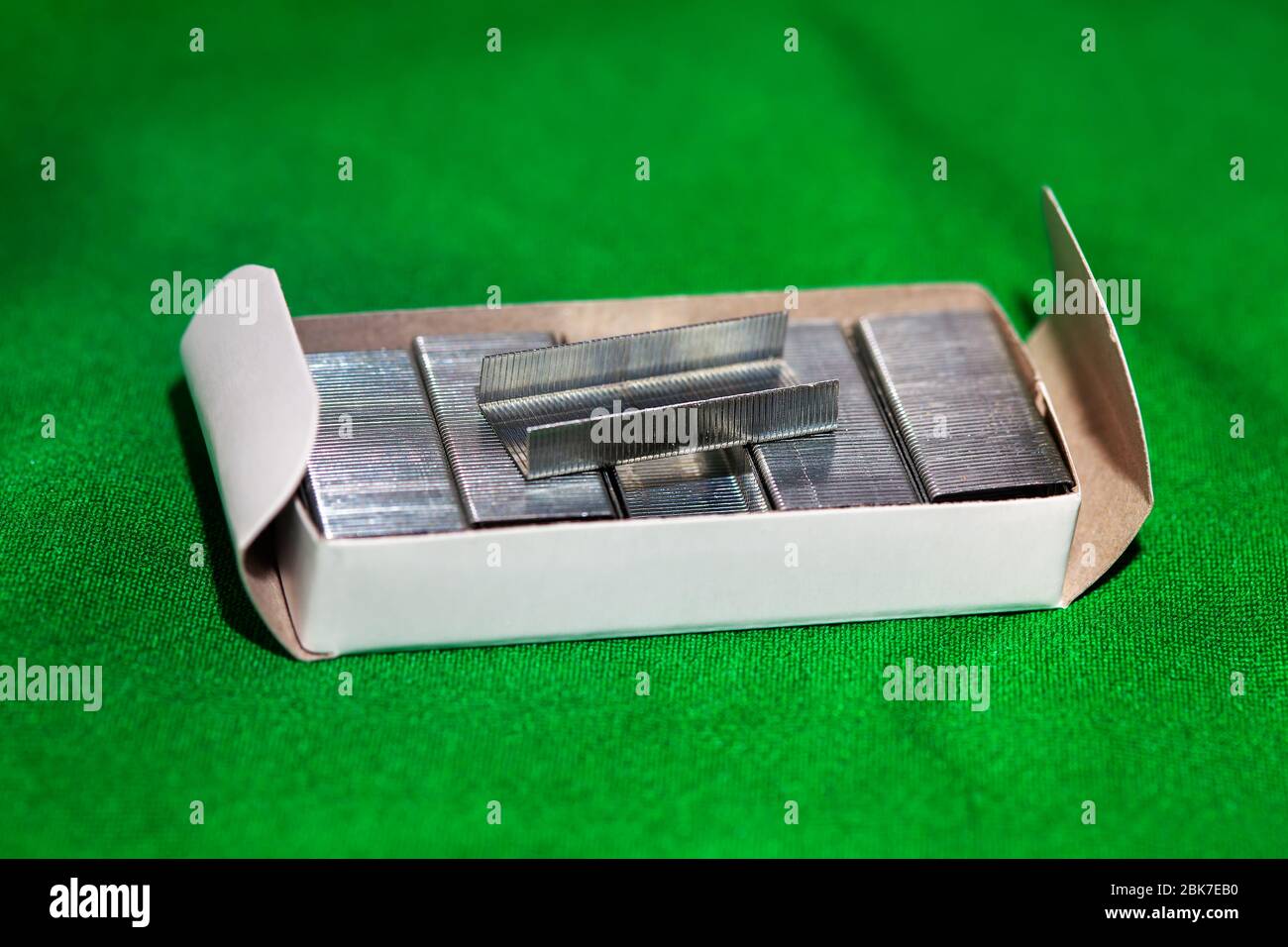 new metalic staples in the box Stock Photo - Alamy