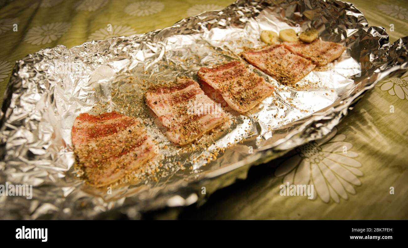 Preparation of billet, balyk with salt and pepper. Foil roasting Stock ...