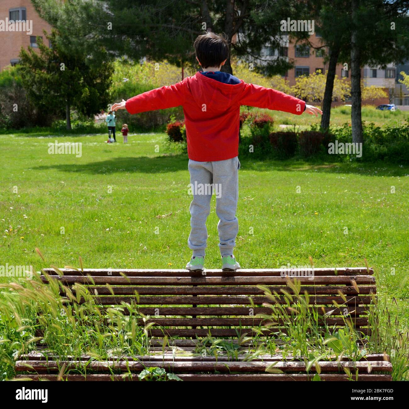 Boy on garden bench hi-res stock photography and images - Alamy