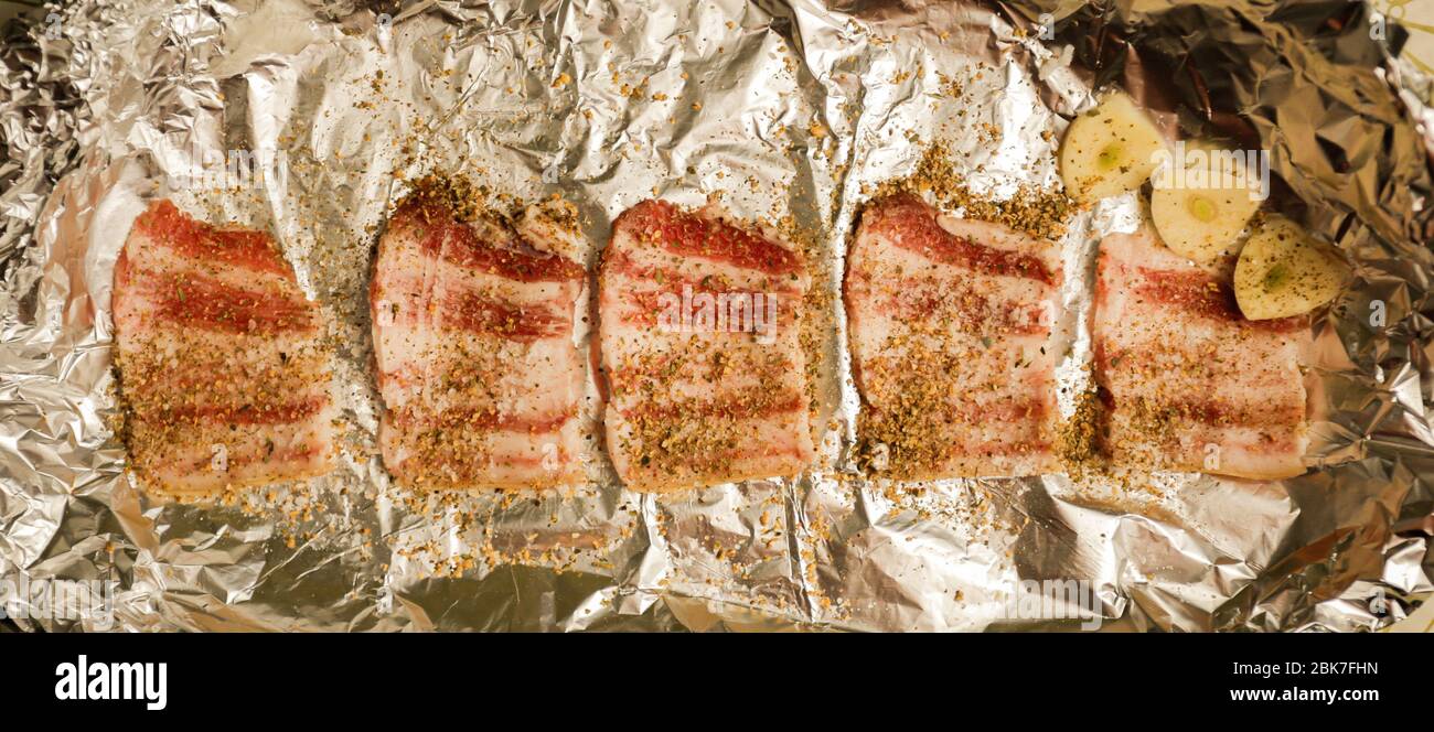 Preparation of billet, balyk with salt and pepper. Foil roasting Stock ...