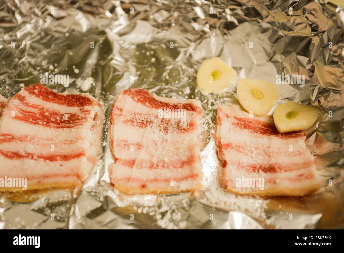 Preparation of billet, balyk with salt and pepper. Foil roasting Stock ...