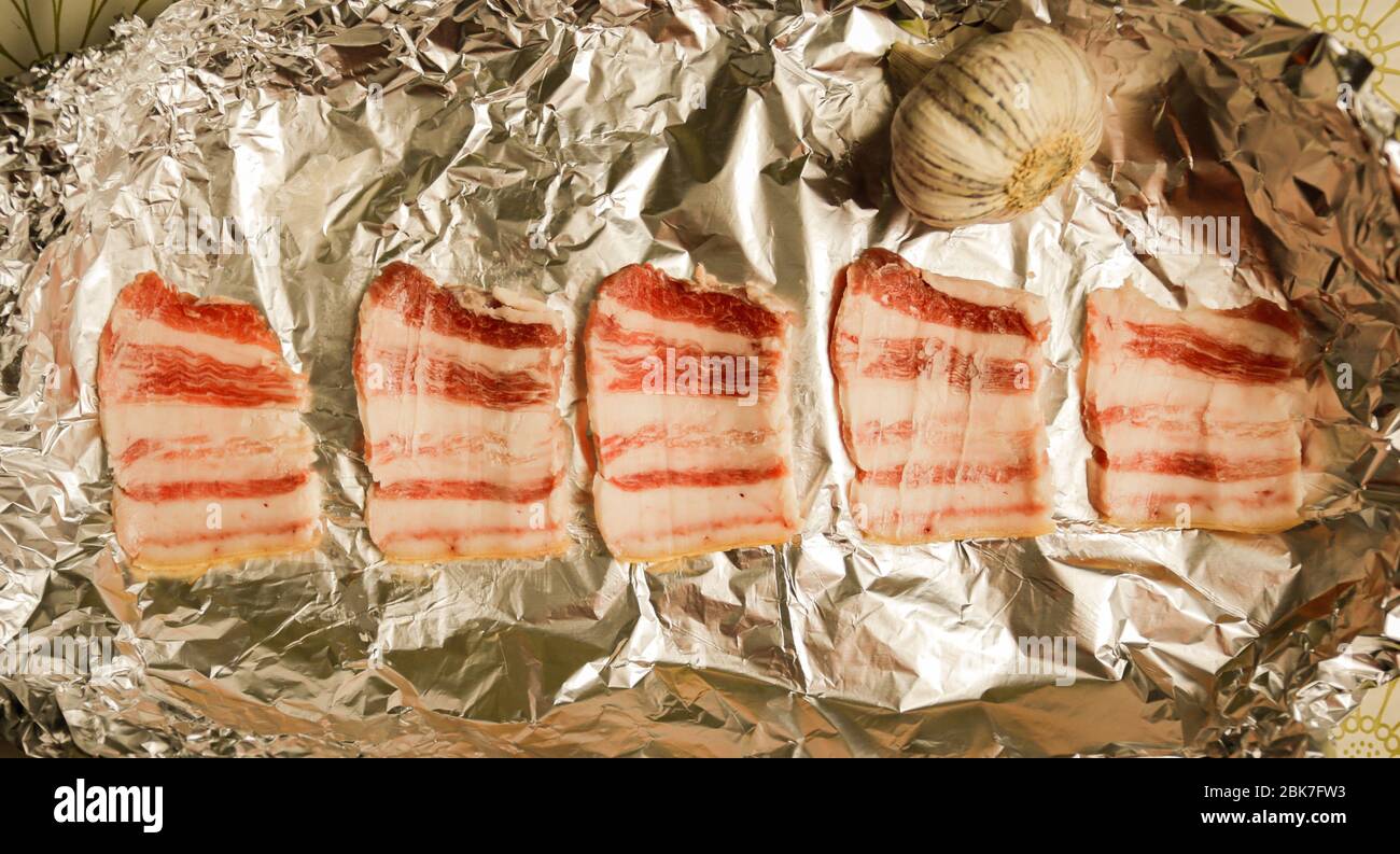 Preparation of billet, balyk with salt and pepper. Foil roasting Stock ...