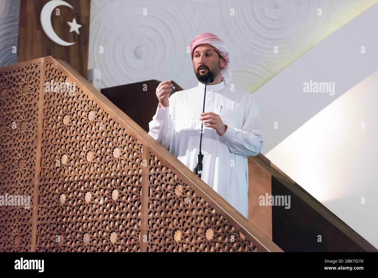 Muslims young arabic Imam has a speech on friday afternoon prayer in ...
