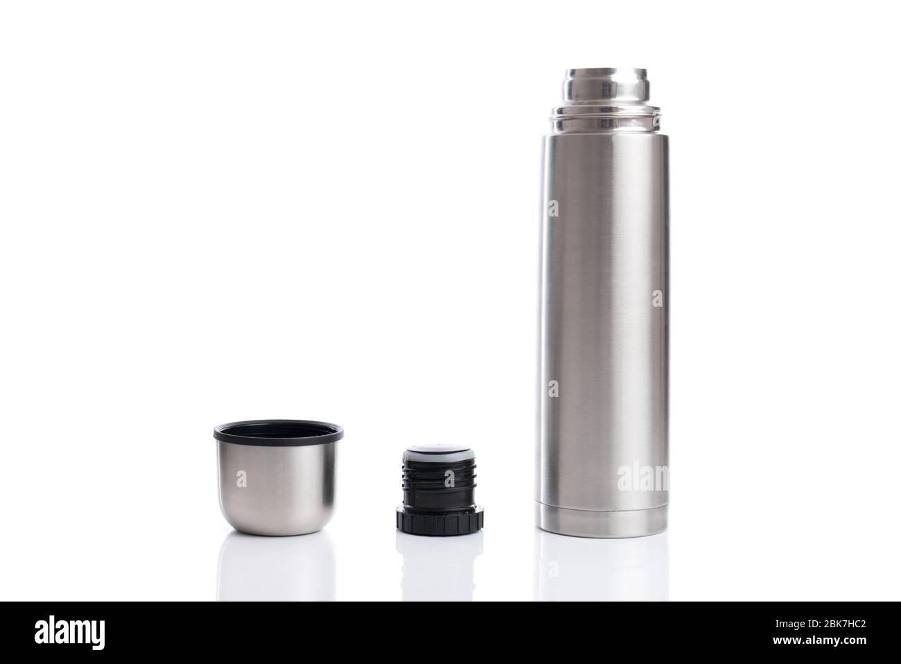 Metal thermos with opened bottle cap isolated over white background ...