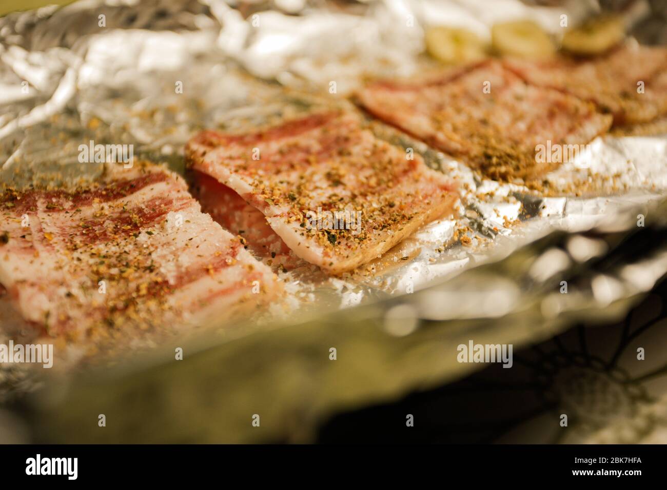 Preparation of billet, balyk with salt and pepper. Foil roasting Stock ...