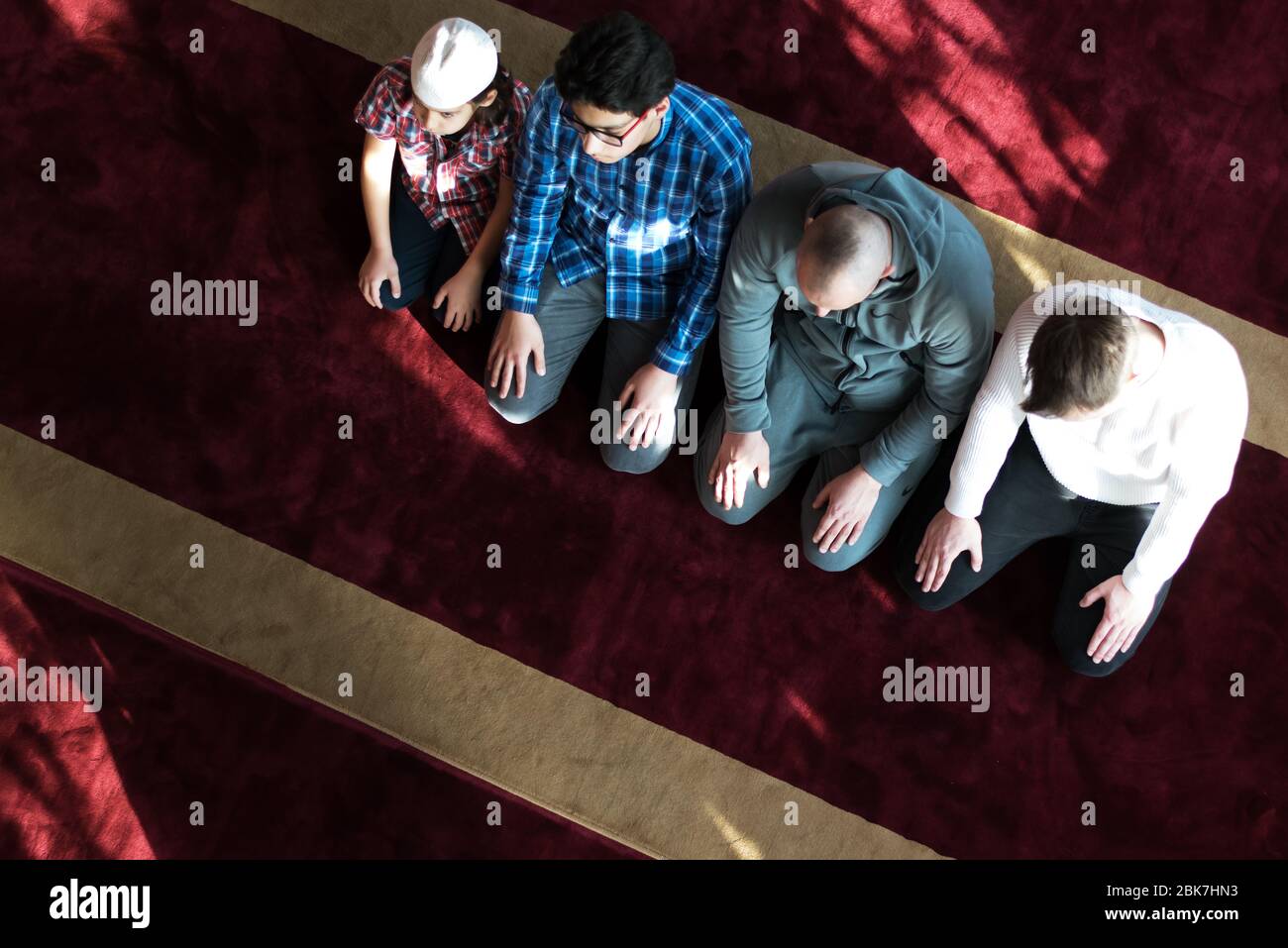 Group of young multiethnic Muslim people praying. Muslim prayers doing ...