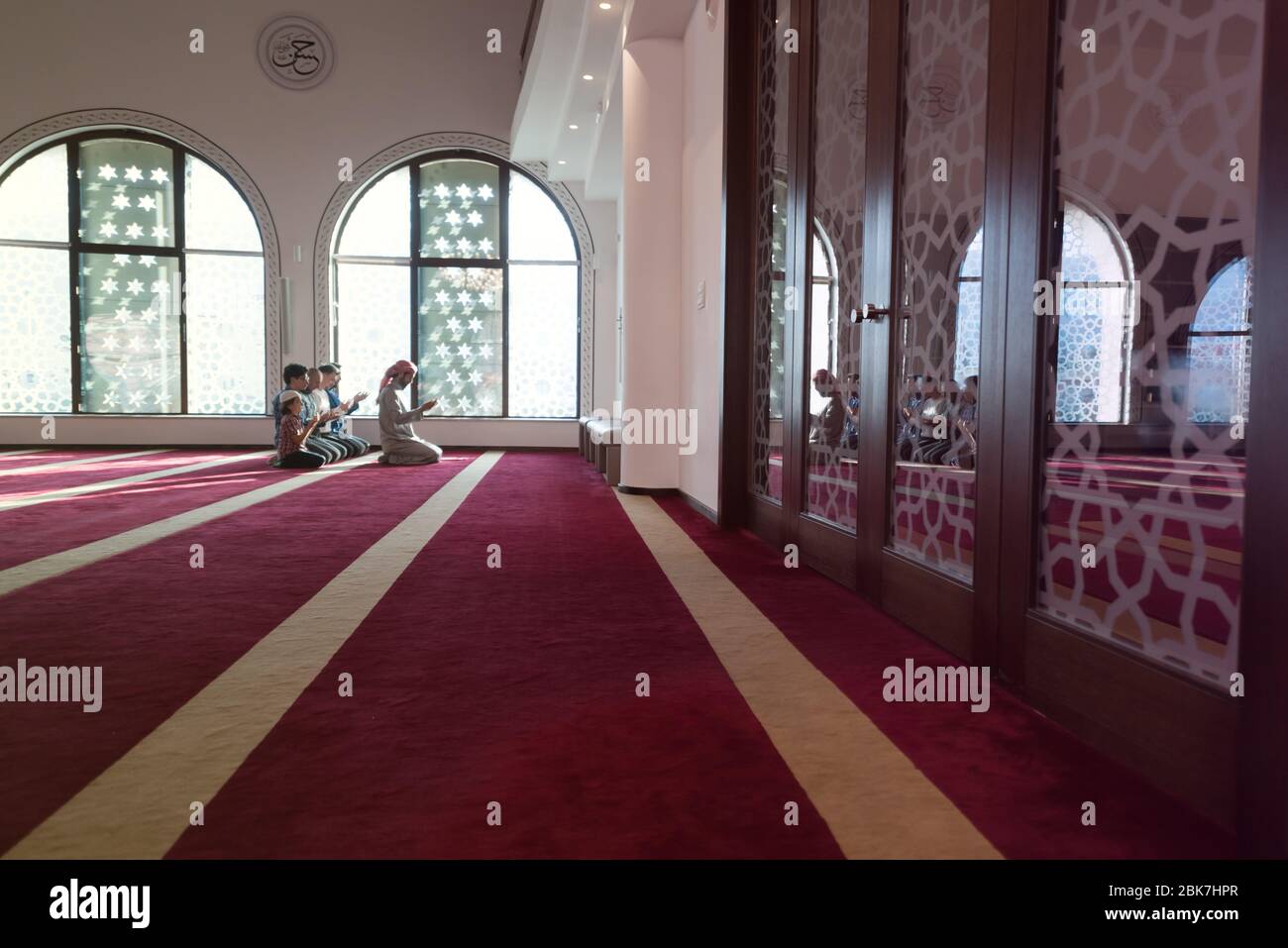 Group of young multiethnic Muslim people praying. Muslim prayers doing ...