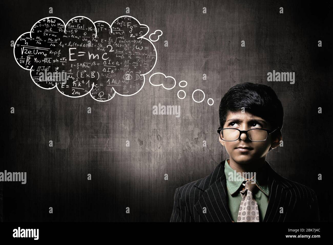 Cute Intelligent Little Boy Wearing Glasses On Nose, Thinking While ...