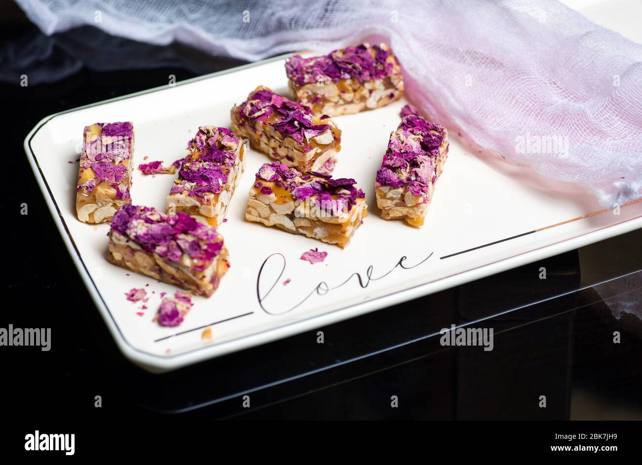 Rose natural candy dessert with natural flowers and peanuts Stock Photo ...