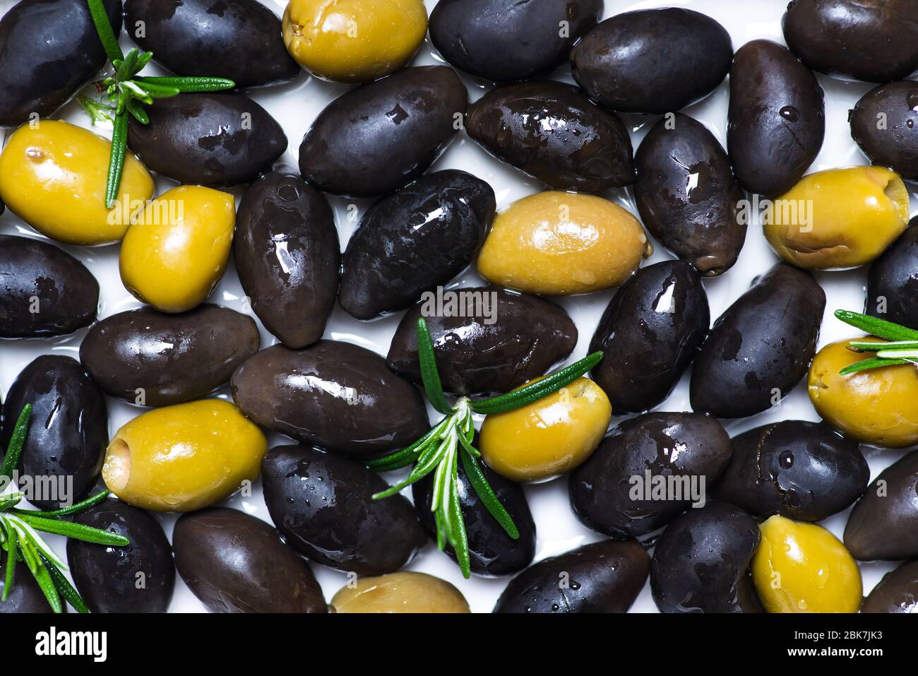 Flat-lay of fresh harvested seasonal pickled Mediterranean olives ...