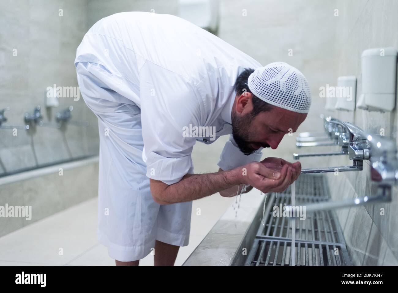Muslim man taking ablution for prayer. Islamic Religious Rite Ceremony ...