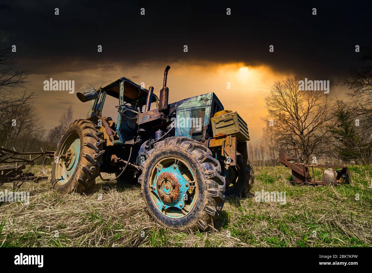 old tractor on the grass field Stock Photo - Alamy