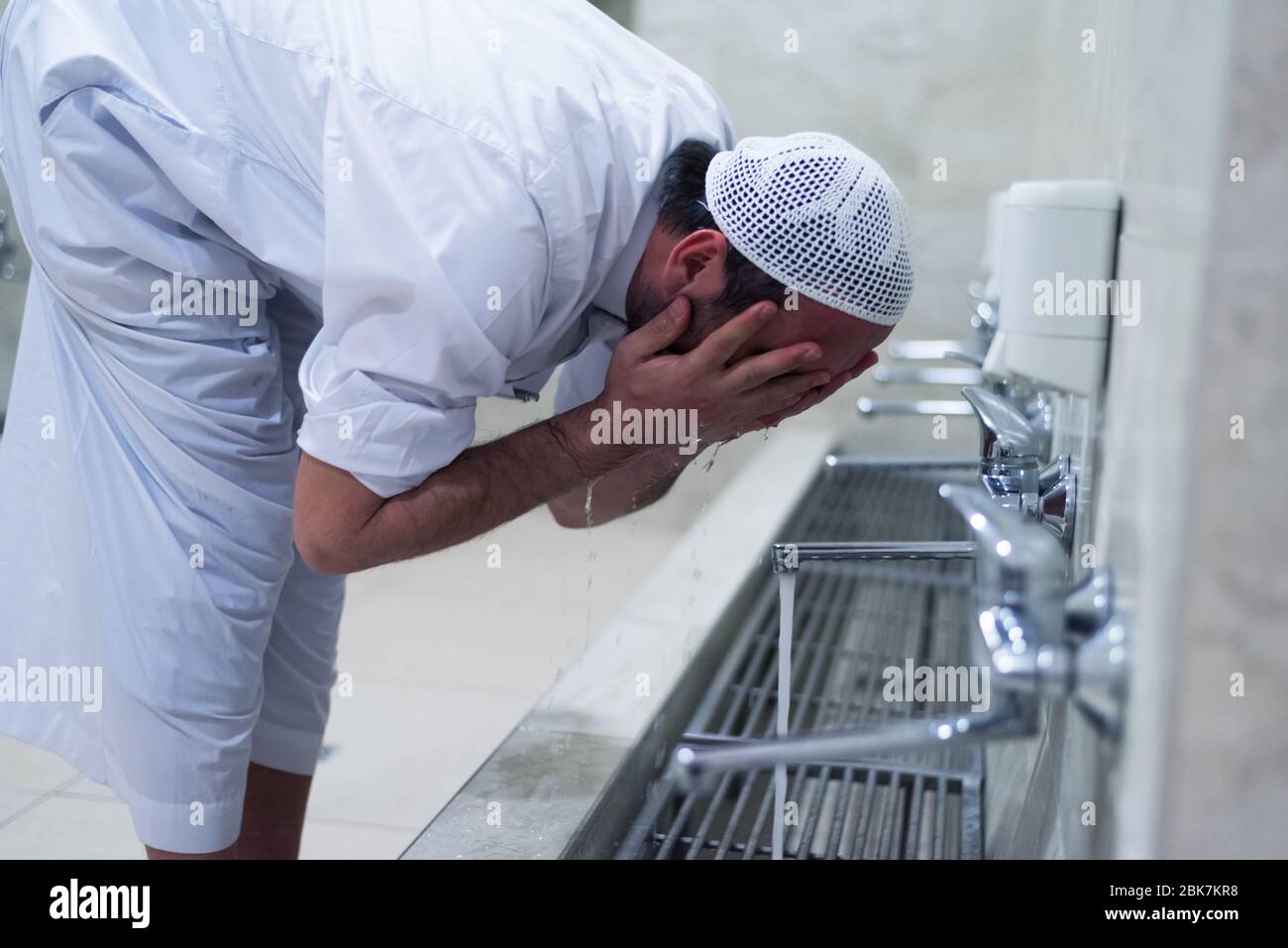 Muslim man taking ablution for prayer. Islamic Religious Rite Ceremony ...