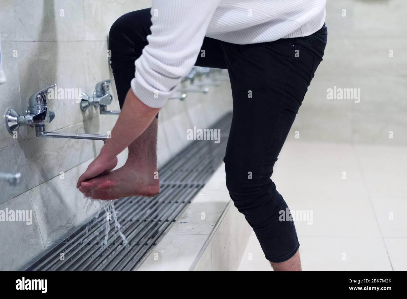 Muslim man taking ablution for prayer. Islamic Religious Rite Ceremony ...