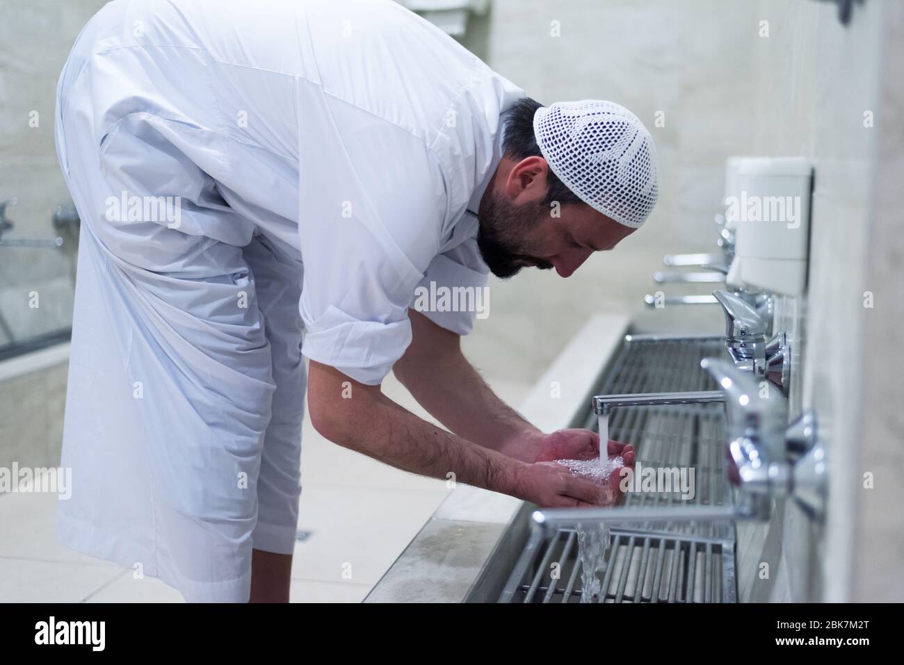 Muslim man taking ablution for prayer. Islamic Religious Rite Ceremony ...