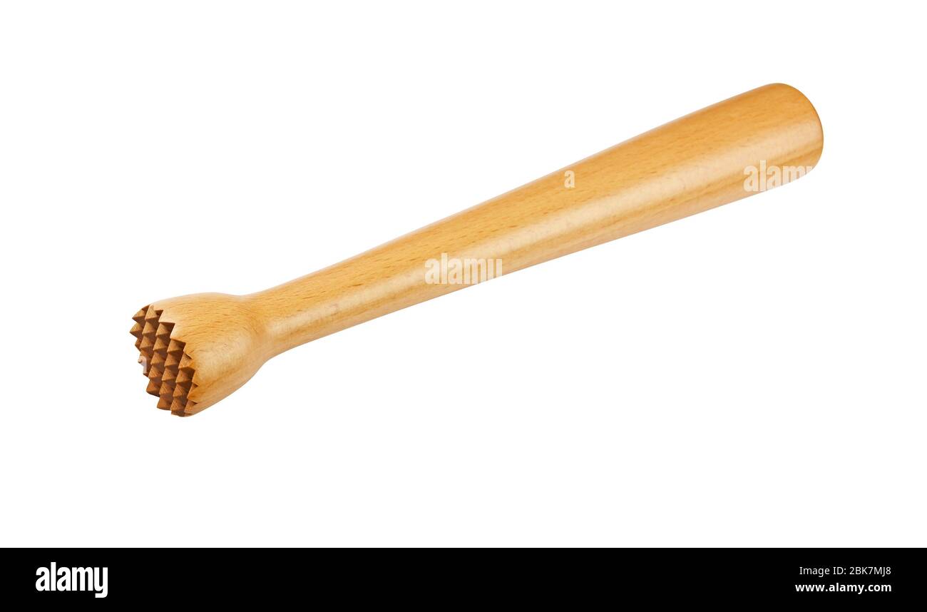 Close up traditional brown wooden muddler to mash fruits for mojito ...