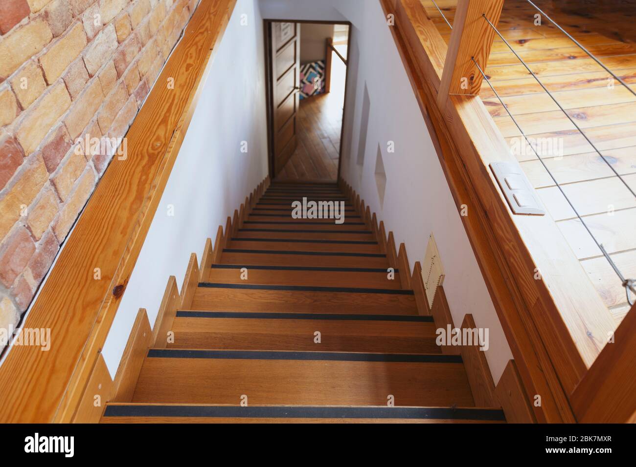 Wooden staircase in coworking space with wall Stock Photo - Alamy