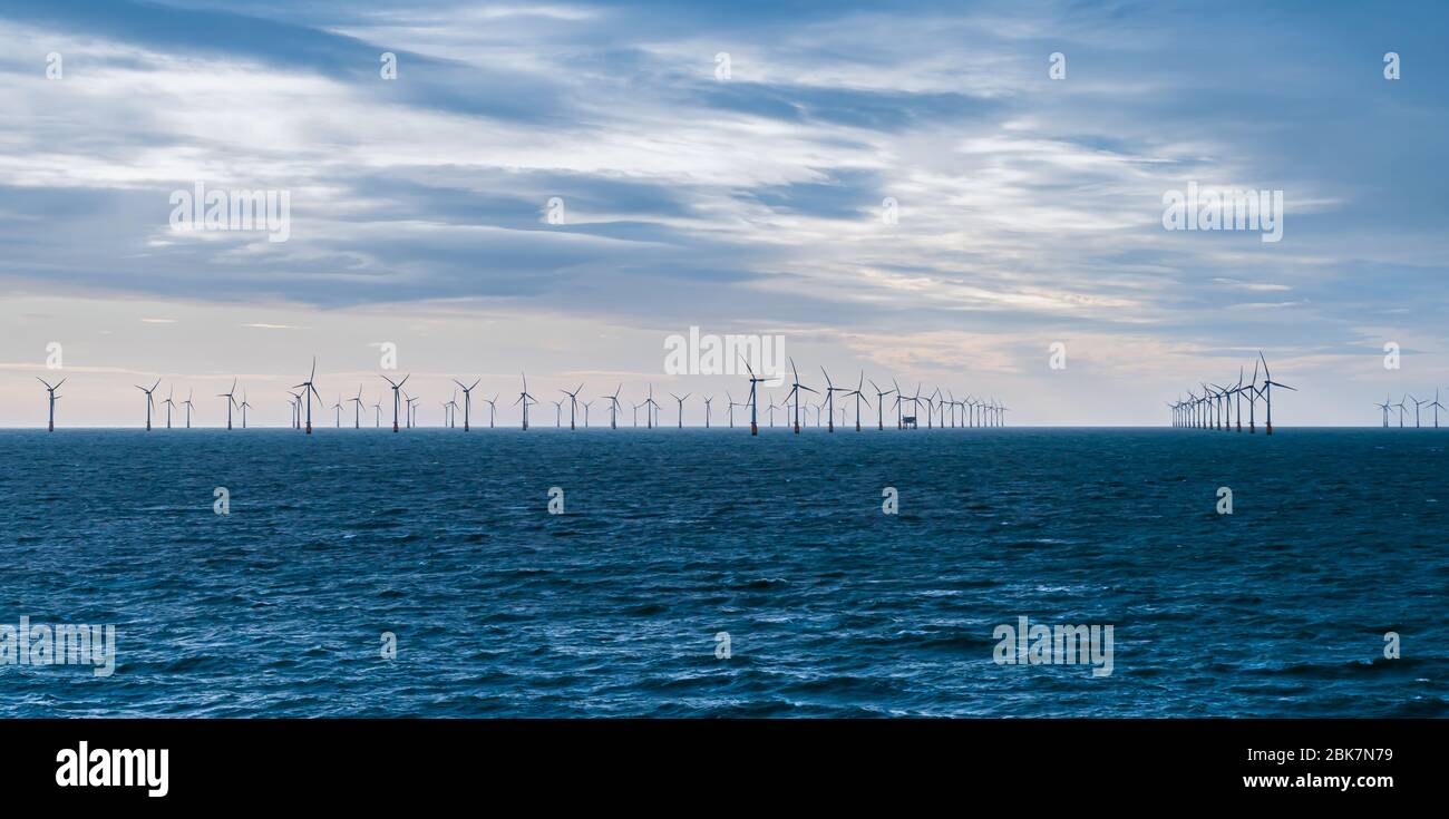 Wind turbines at sea. Offshore wind power farm in the North Sea Stock ...