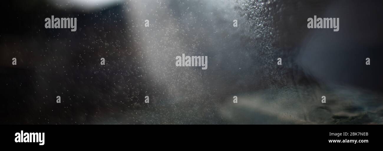 Small drops of water beaten by the sun in the counter-jour form gray ...