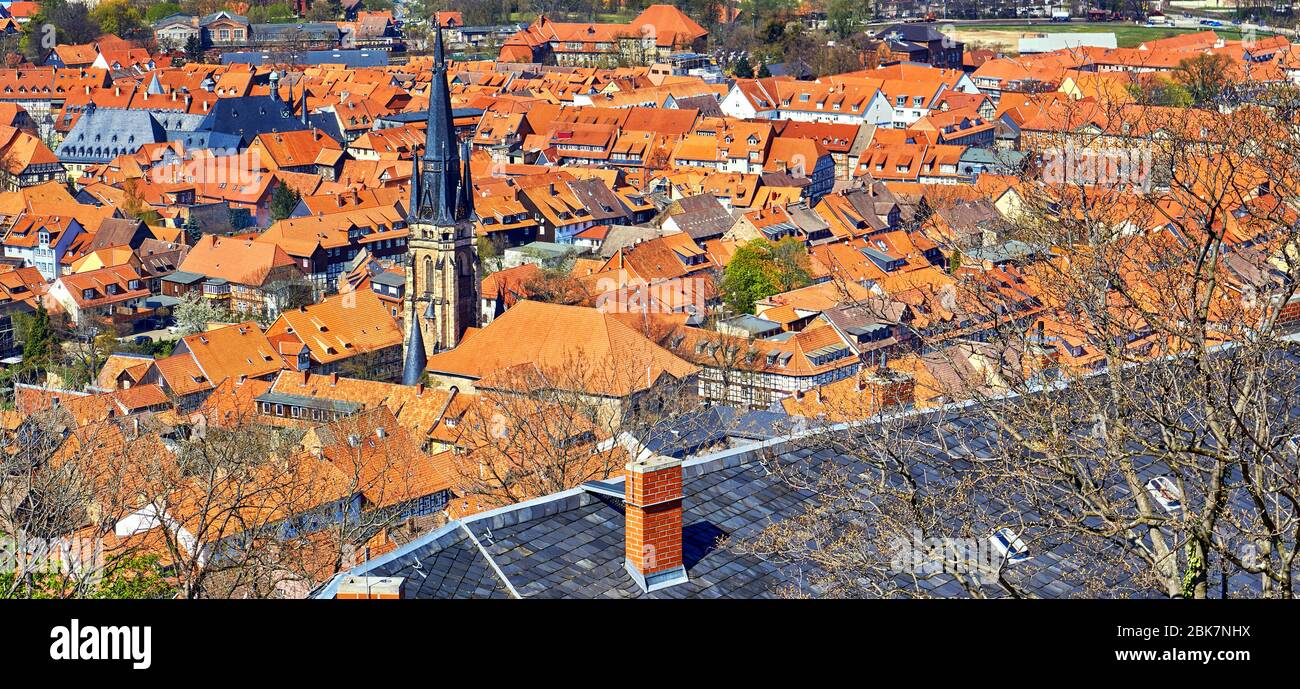 Church tower between the red roofs of the city of Wernigerode. Saxony ...