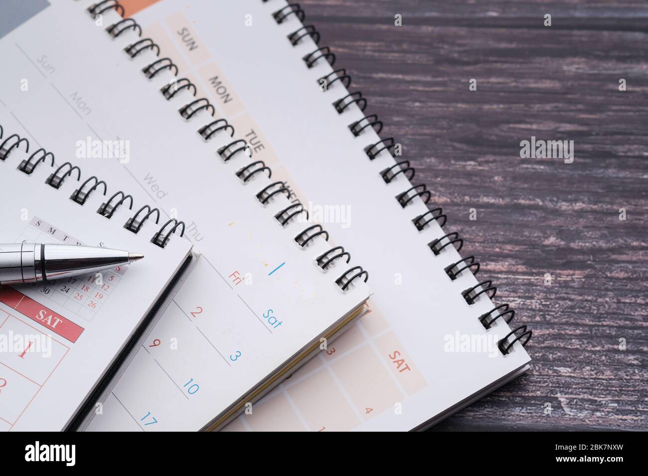 stack of calendar and pen on office desk Stock Photo - Alamy